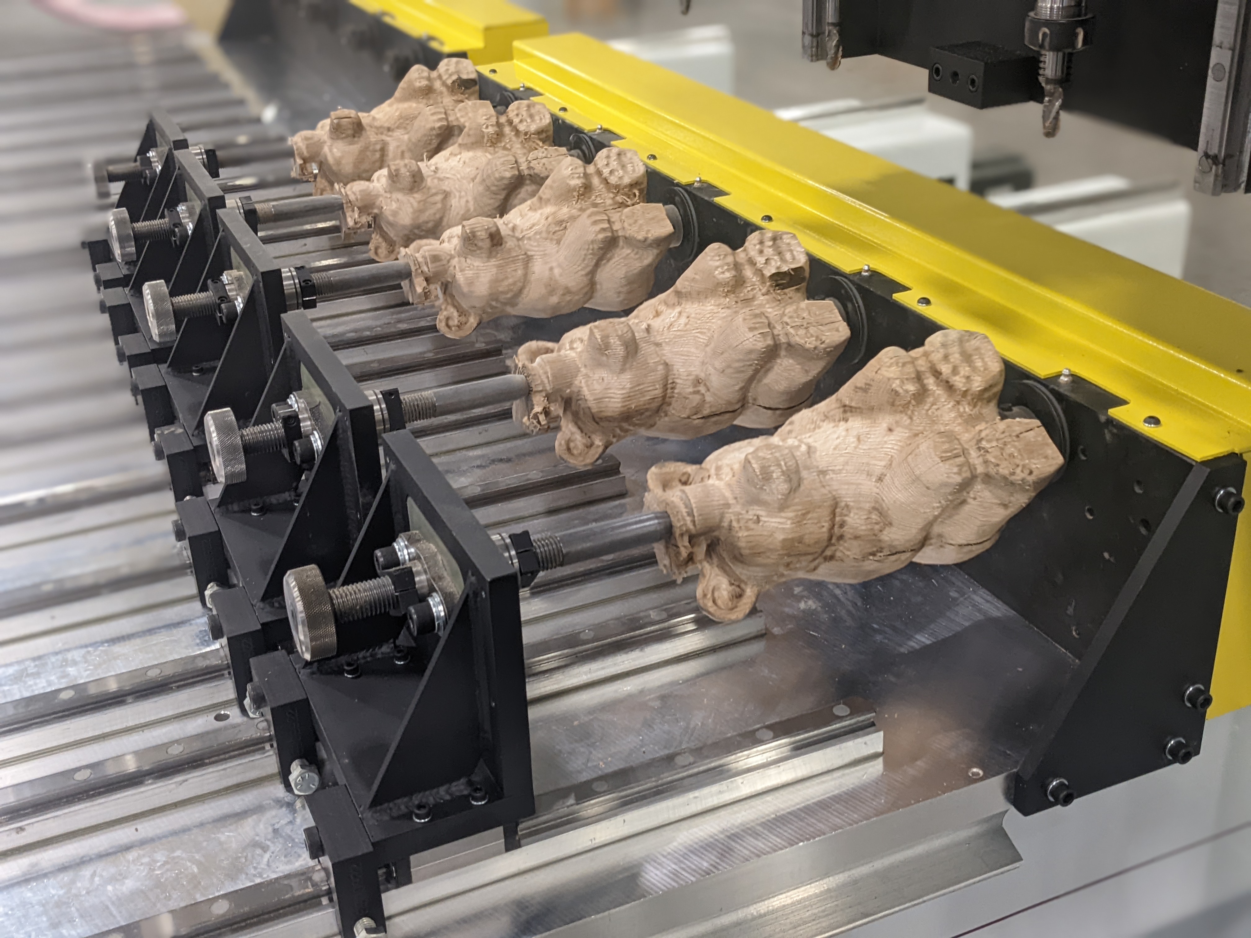 Watch a Thermwood Model 42 Dual Table Machine Carve 5 Bears Simultaneously!